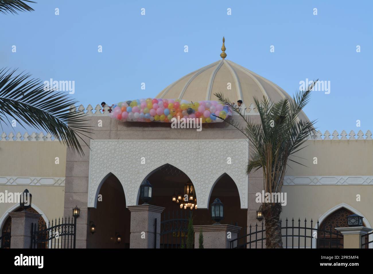 Cairo, Egypt, April 21 2023: Throwing balloons for kids and children ...