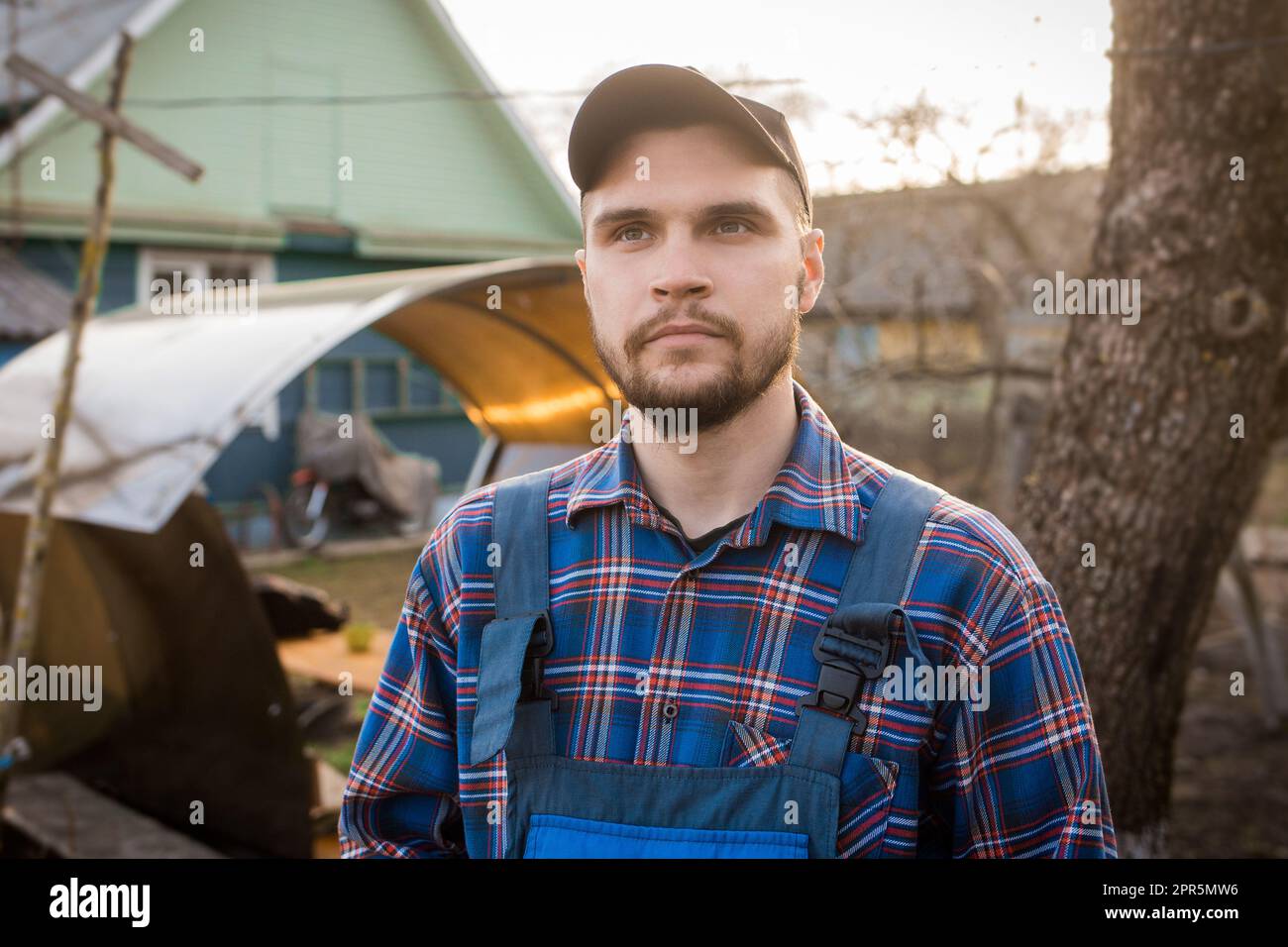 A farmer man of European appearance rural portrait with a beard, a ...