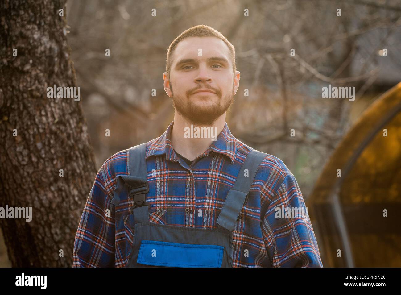 Farmer satisfied european appearance male rural portrait at sunlight ...