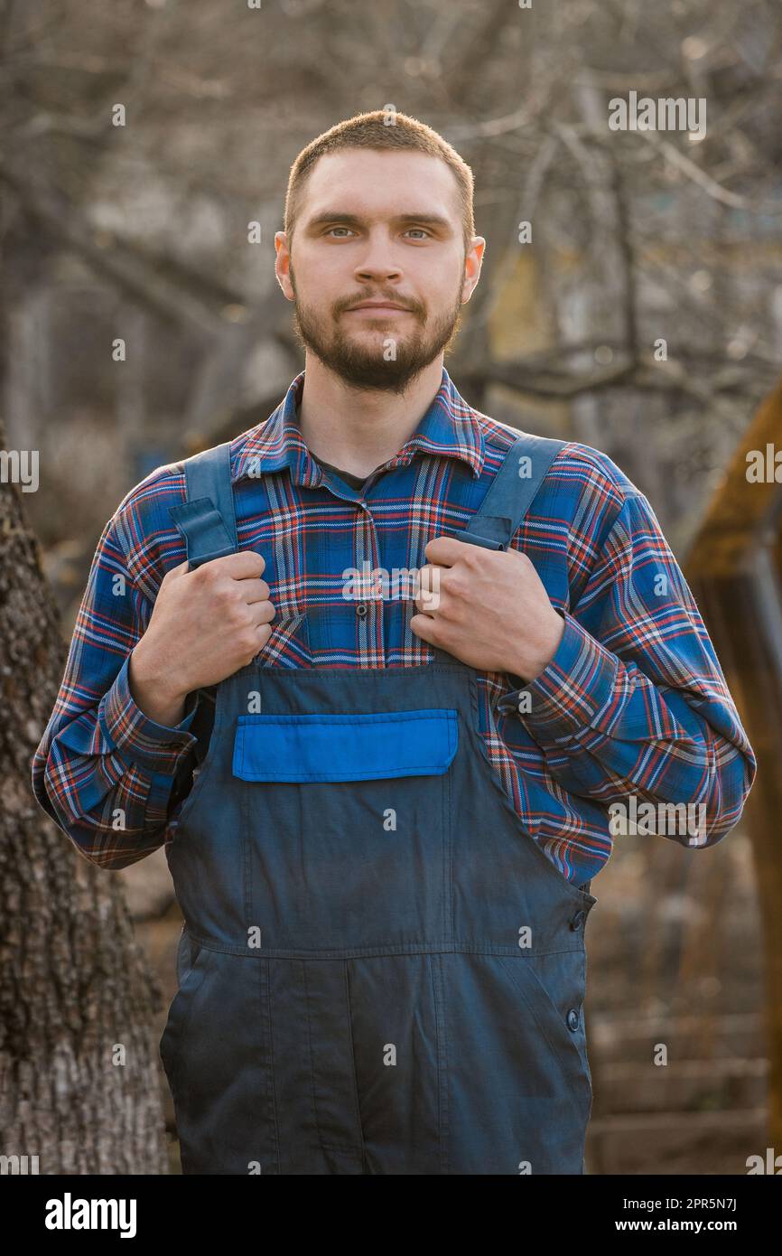Farmer satisfied european appearance male rural portrait at sunlight ...