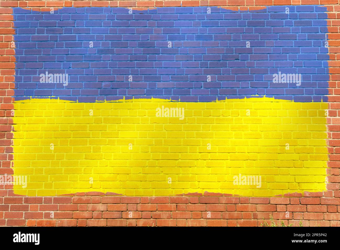 The flag of Ukraine is painted on a brick wall, Close-up. Background ...