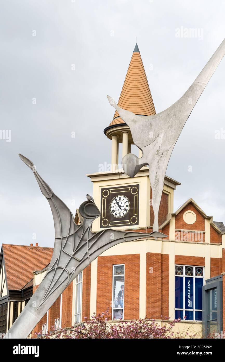 Empowerment statue embracing clock hi-res stock photography and images ...