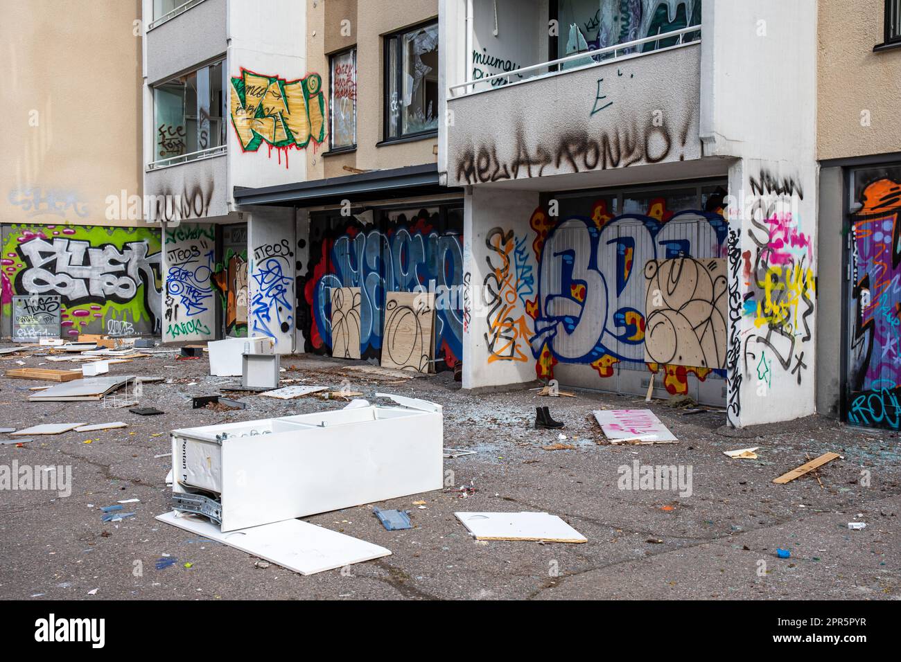 Vandalized and graffiti covered residential building before demolition ...