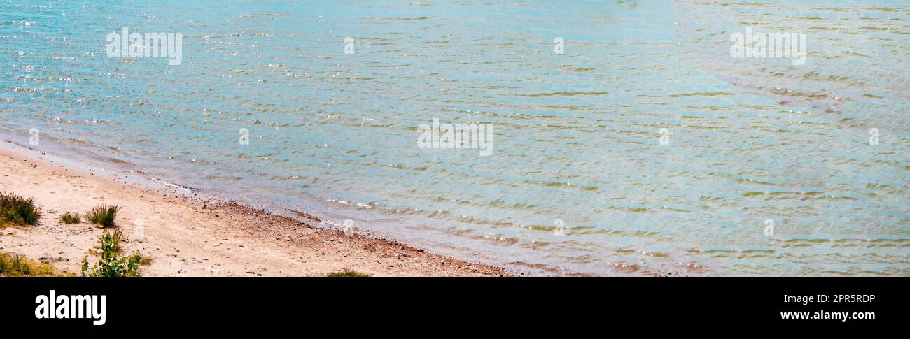 Banner with a copy of the space on the right, Sandy riverbank with ...