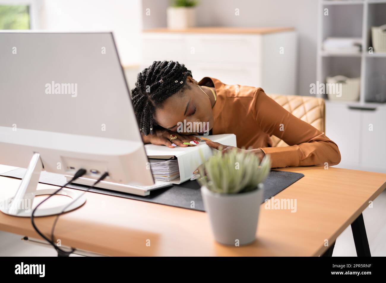 Bored Boss Woman Sleeping Stock Photo - Alamy