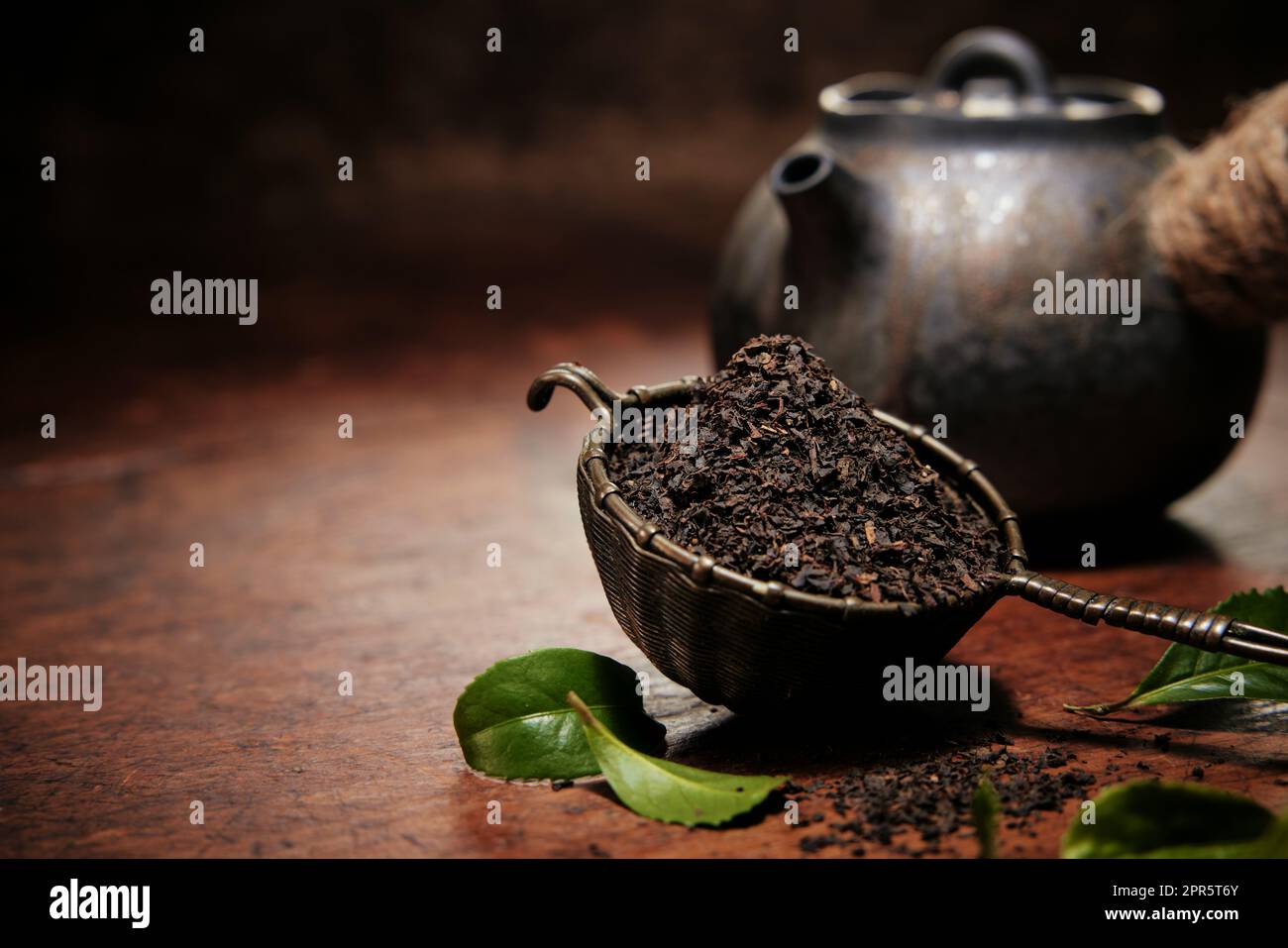 Loose tea and old teapot in kitchen Stock Photo - Alamy