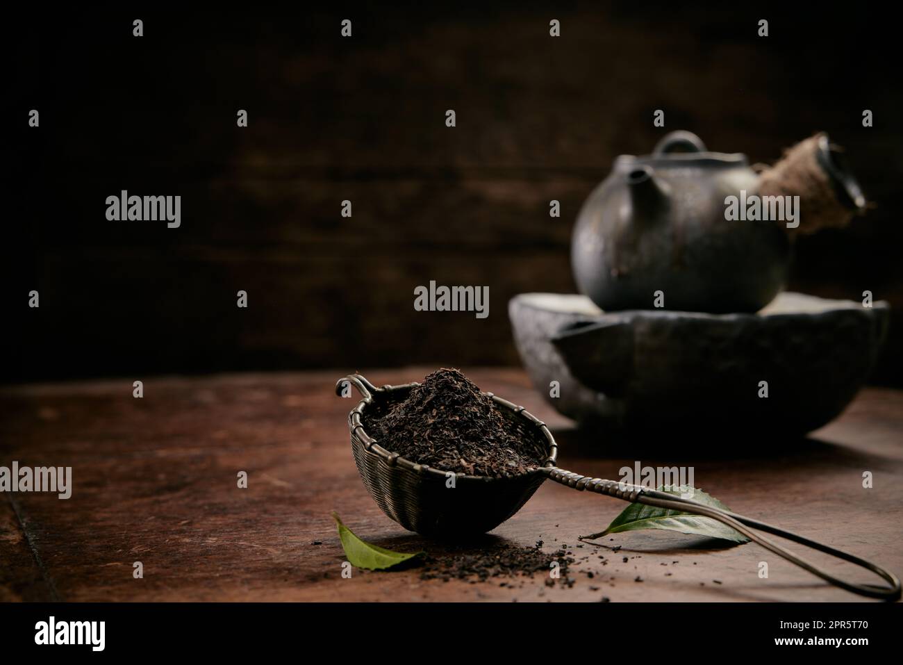 Loose tea near vintage teapot Stock Photo - Alamy