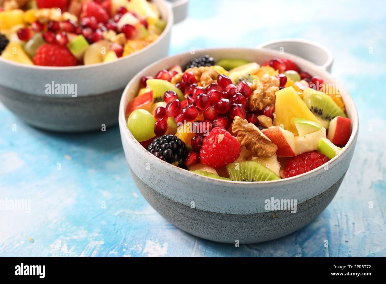 Bowls with various tasty fruits Stock Photo - Alamy
