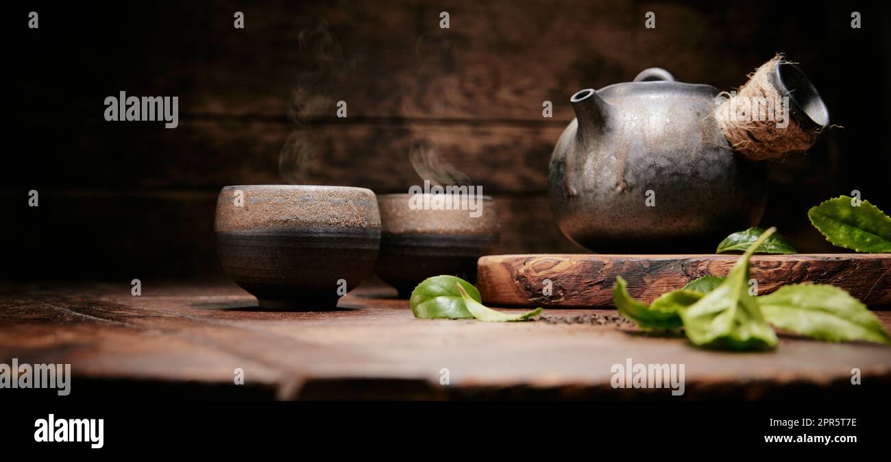 Old tea set near leaves Stock Photo - Alamy