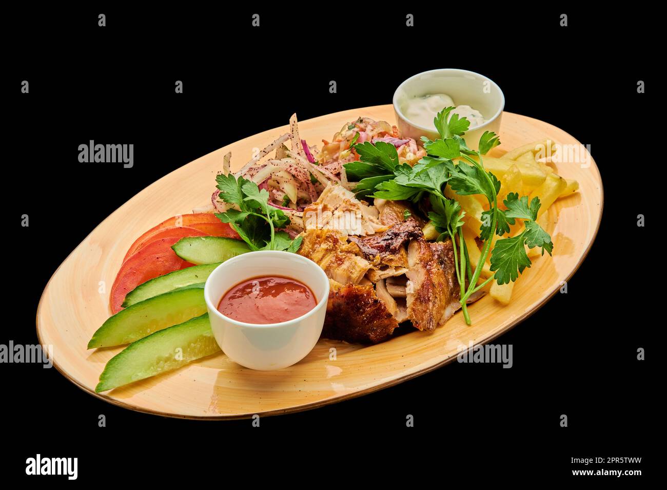 Open chicken shawarma with French fries on a black isolated background ...