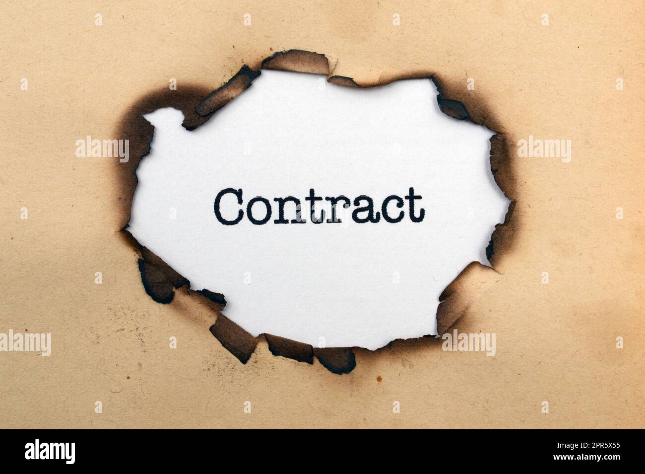 Contract paper hole Stock Photo - Alamy