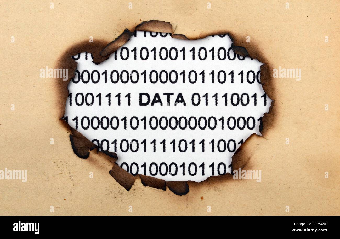 Data text on paper hole Stock Photo - Alamy