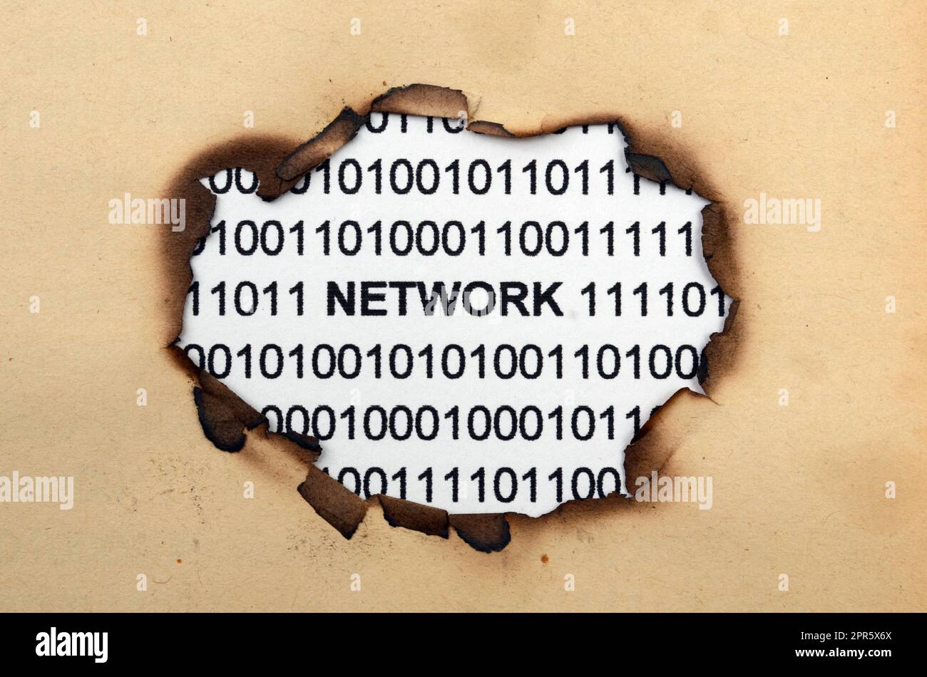 Network on paper hole Stock Photo - Alamy