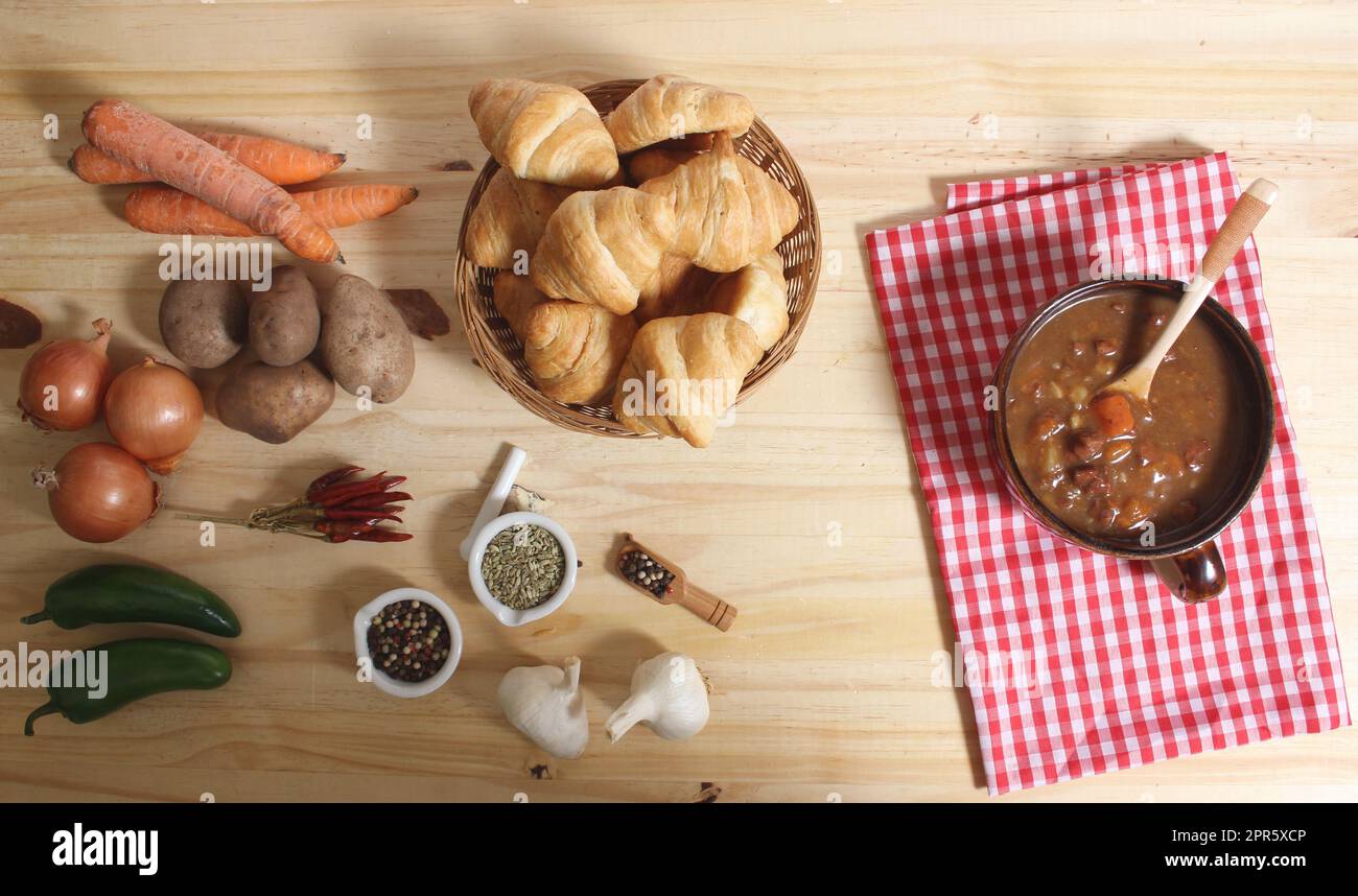Beef Stew and Fresh Bread in Rustic Kitchen With Red and White ...