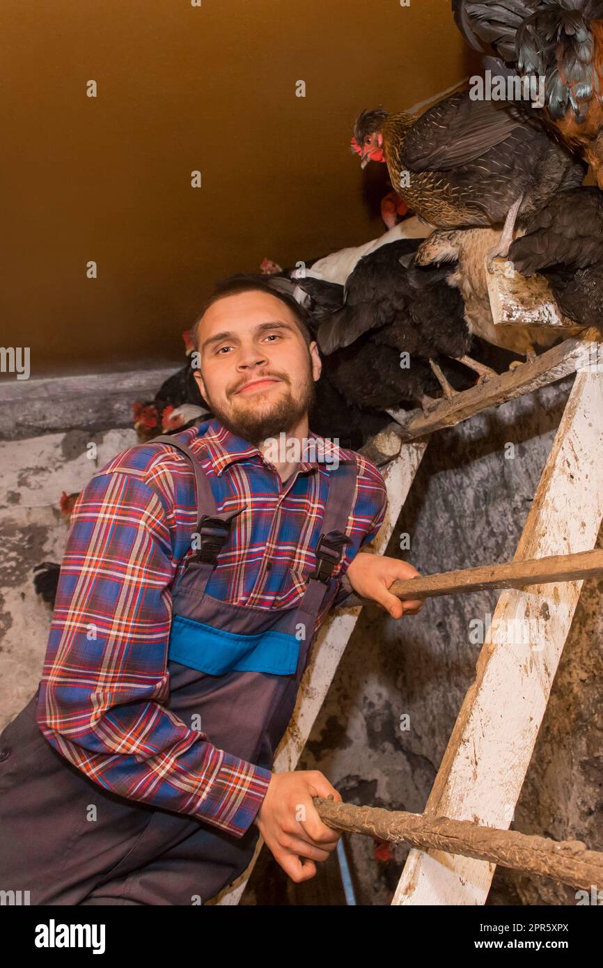 A contented cheerful farmer with a beard, European appearance, in ...