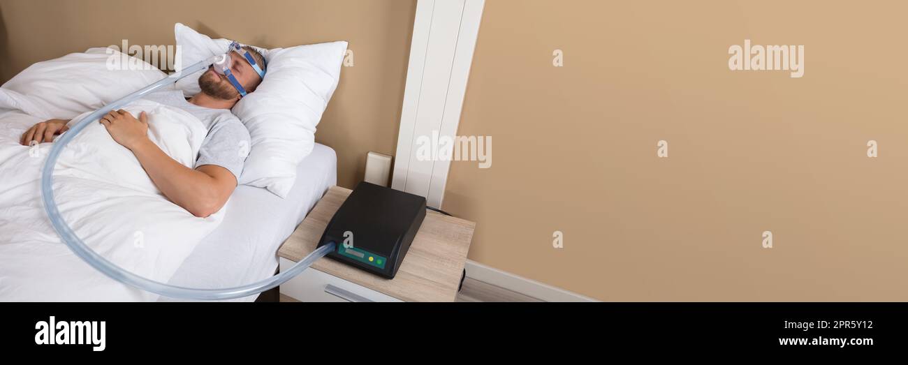 Man With Sleeping Apnea And CPAP Machine Stock Photo - Alamy