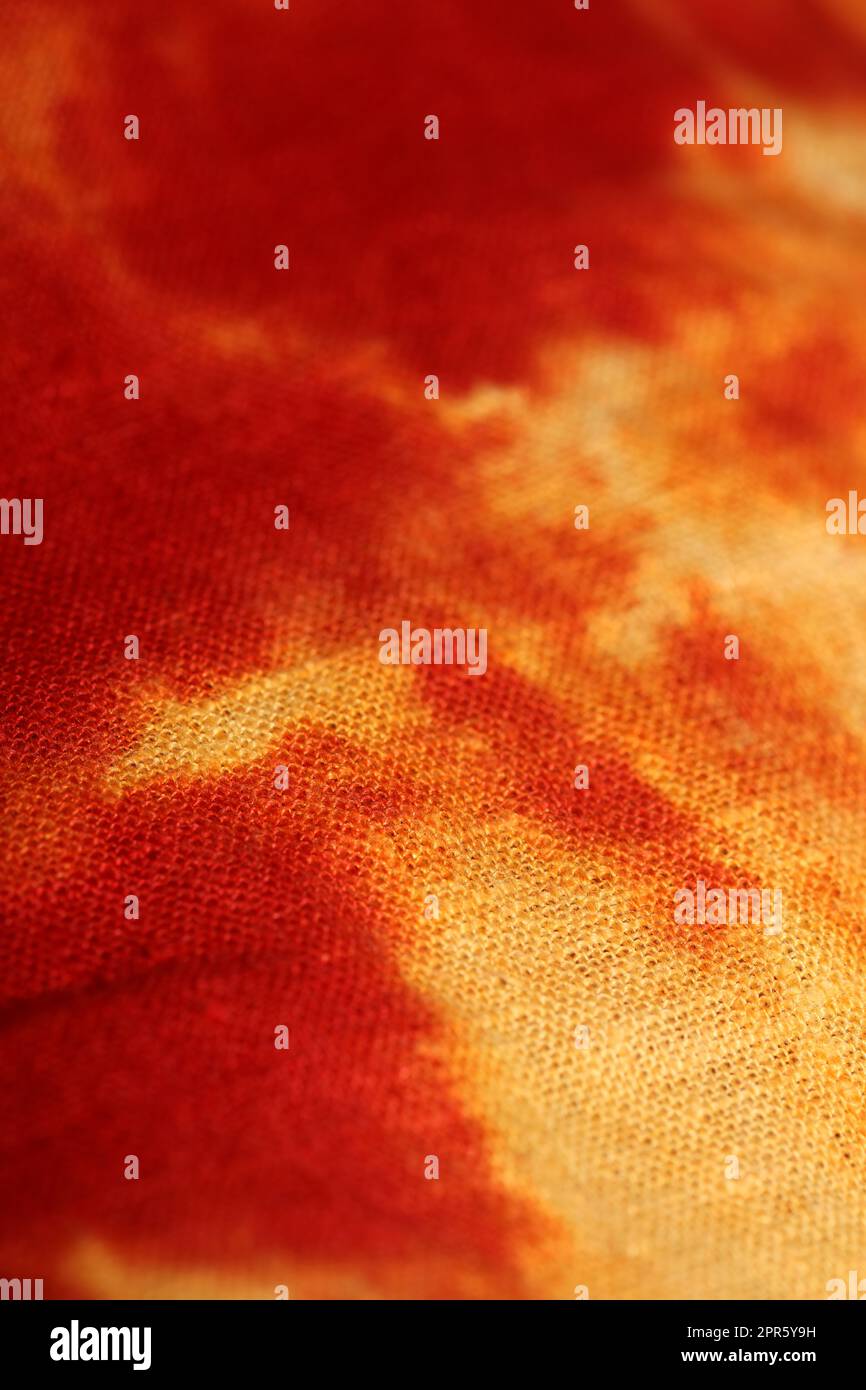 Yellow red textile design made with chlorine close up modern background ...