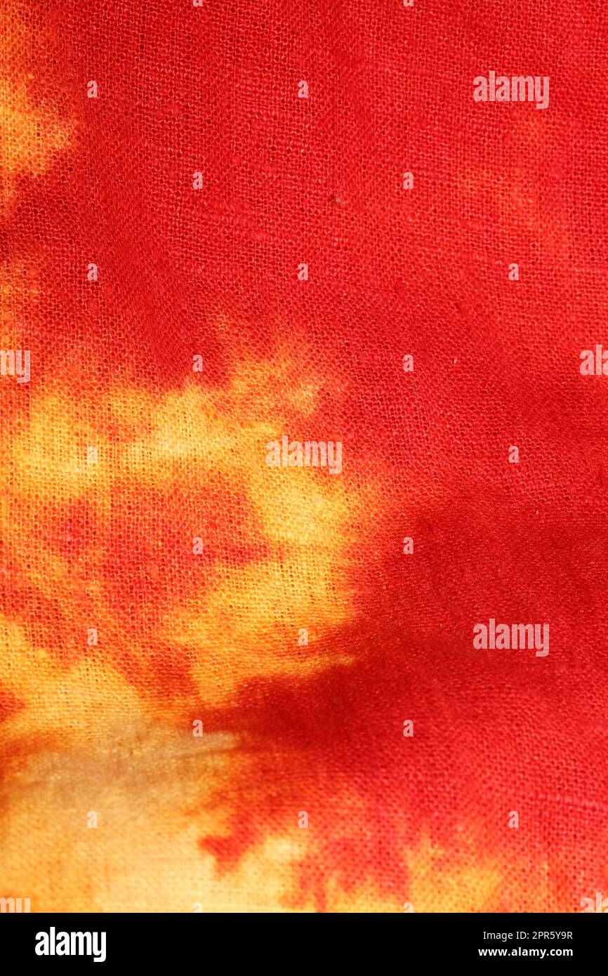 Yellow red textile design made with chlorine close up modern background ...