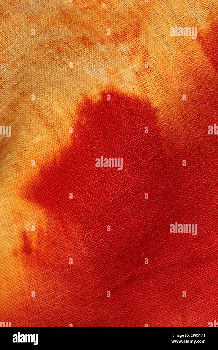 Yellow red textile design made with chlorine close up modern background ...