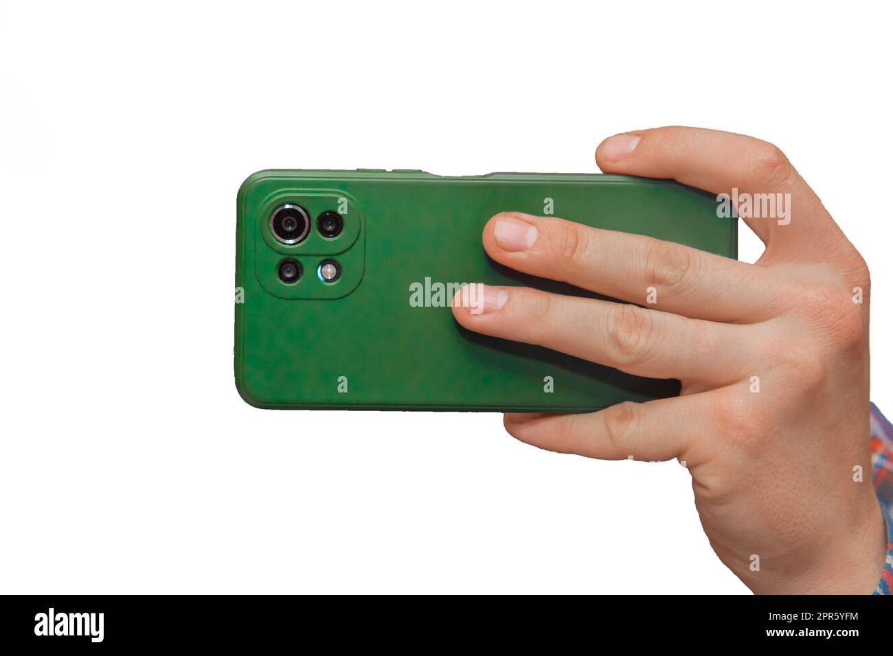 Hand of a man close-up holding a mobile phone or smartphone in a green ...