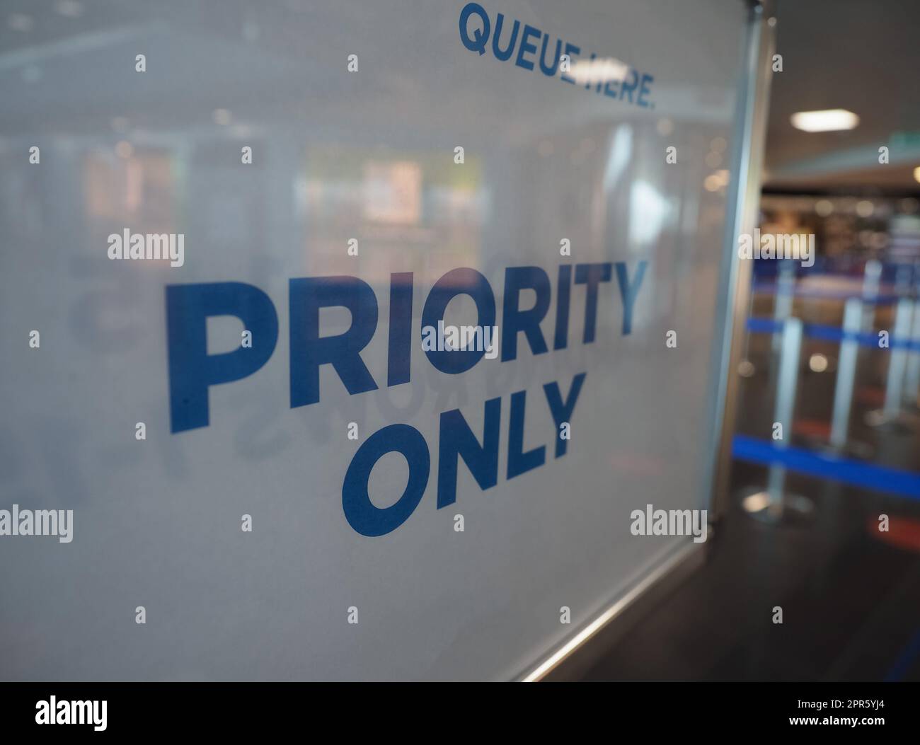 airport priority only queue here sign Stock Photo - Alamy