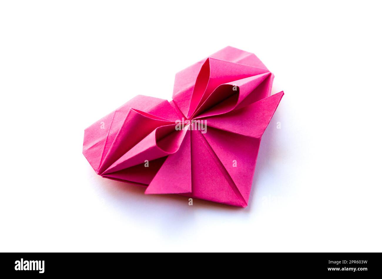Pink paper heart origami isolated on a white background Stock Photo - Alamy
