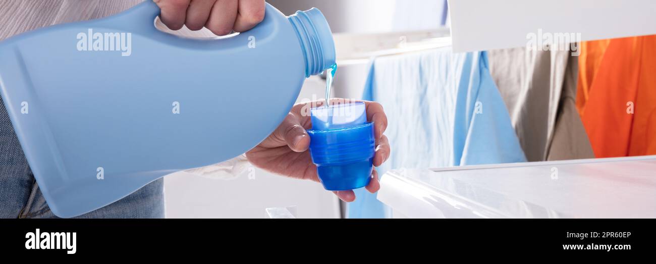 Woman pouring detergent washing machine hi-res stock photography and ...