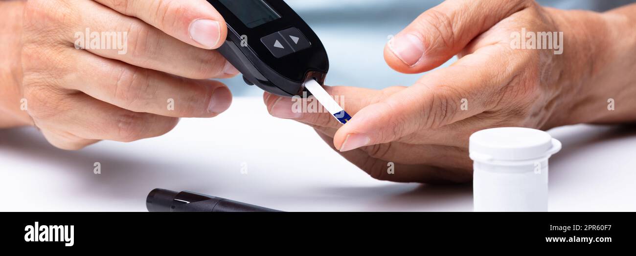 Diabetes test man checking hi-res stock photography and images - Alamy