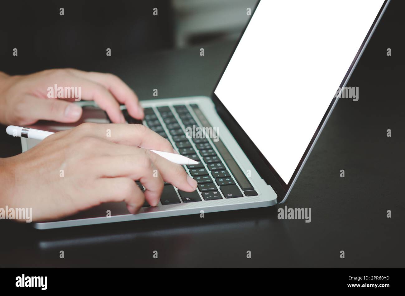businessman using and typing on laptop with blank white screen mock up ...