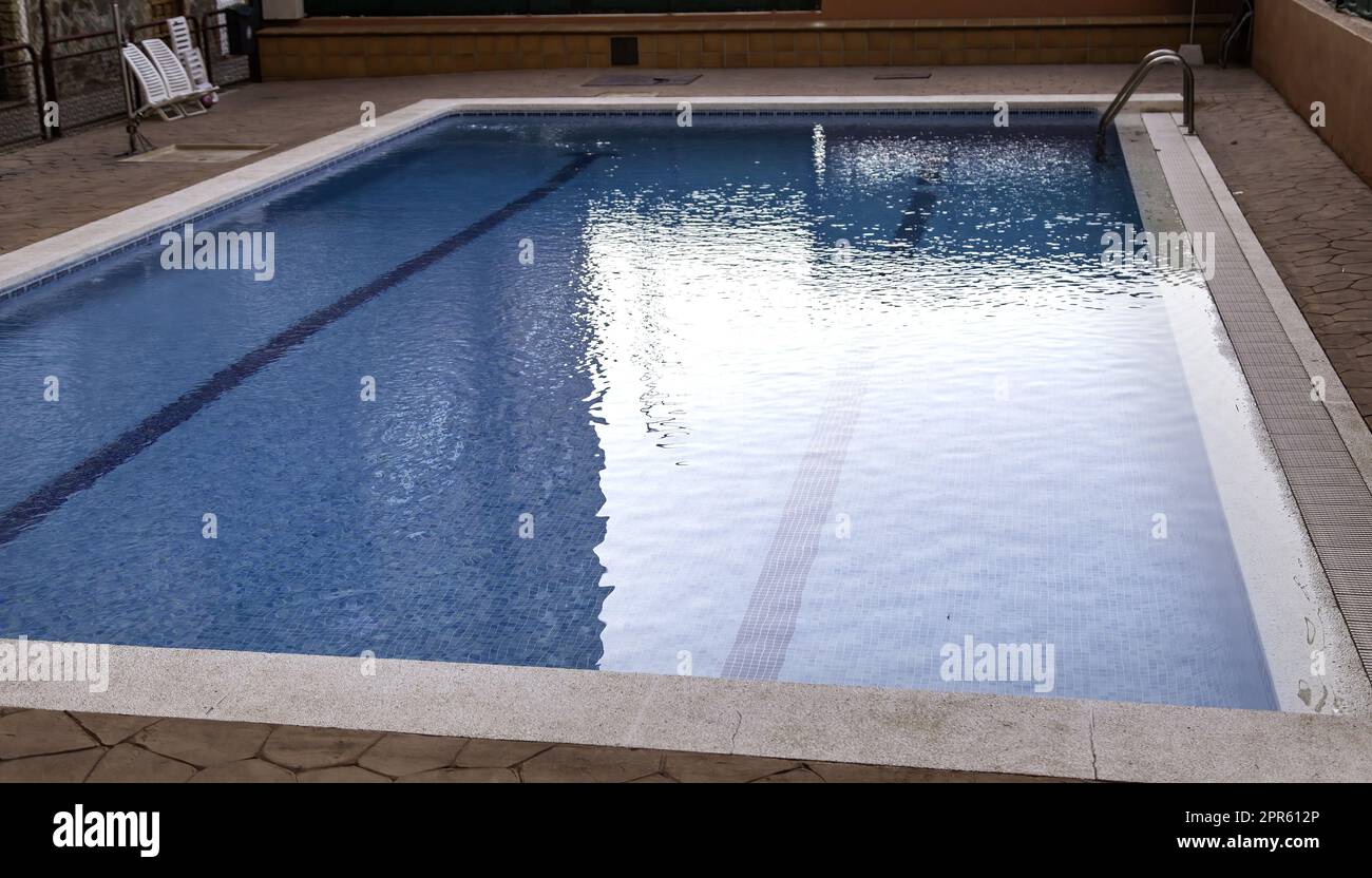 Outdoor swimming pool in summer Stock Photo - Alamy