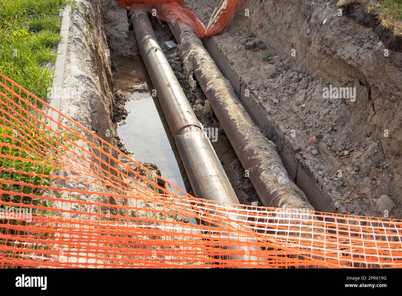 Repair of the heating plant system with the laying of new underground metal pipes in the trench ...