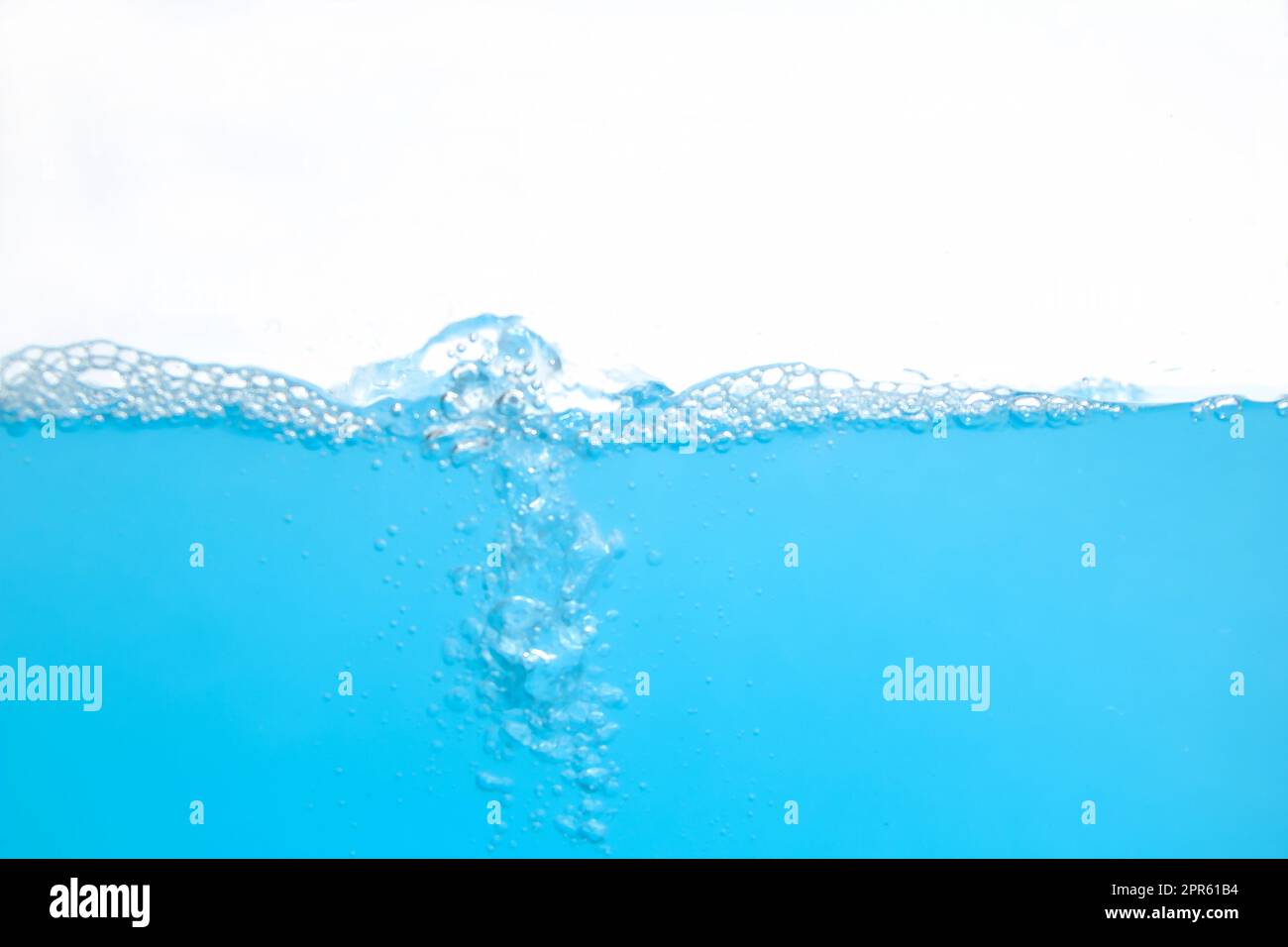 Water splash. Aqua flowing in waves and bubbles . on white background ...
