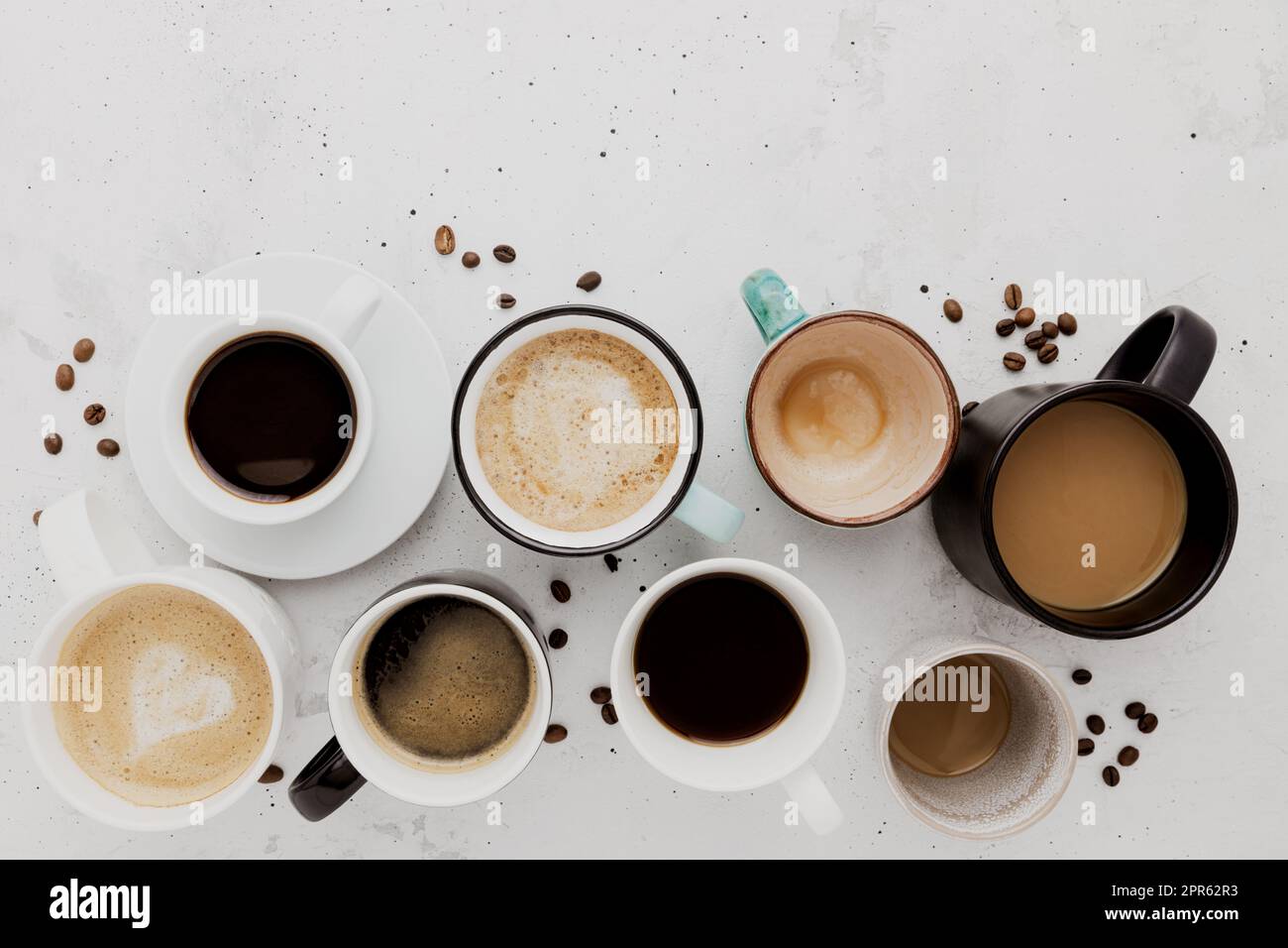 Top view on flat lay with many different full and empty coffee cups on ...