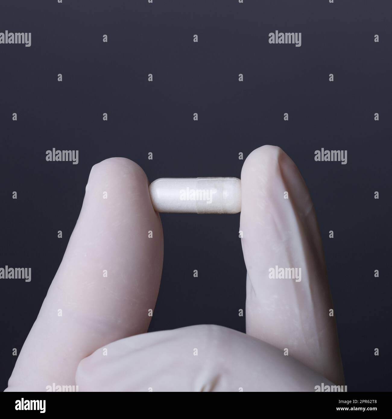 Doctor holding a pill hi-res stock photography and images - Alamy