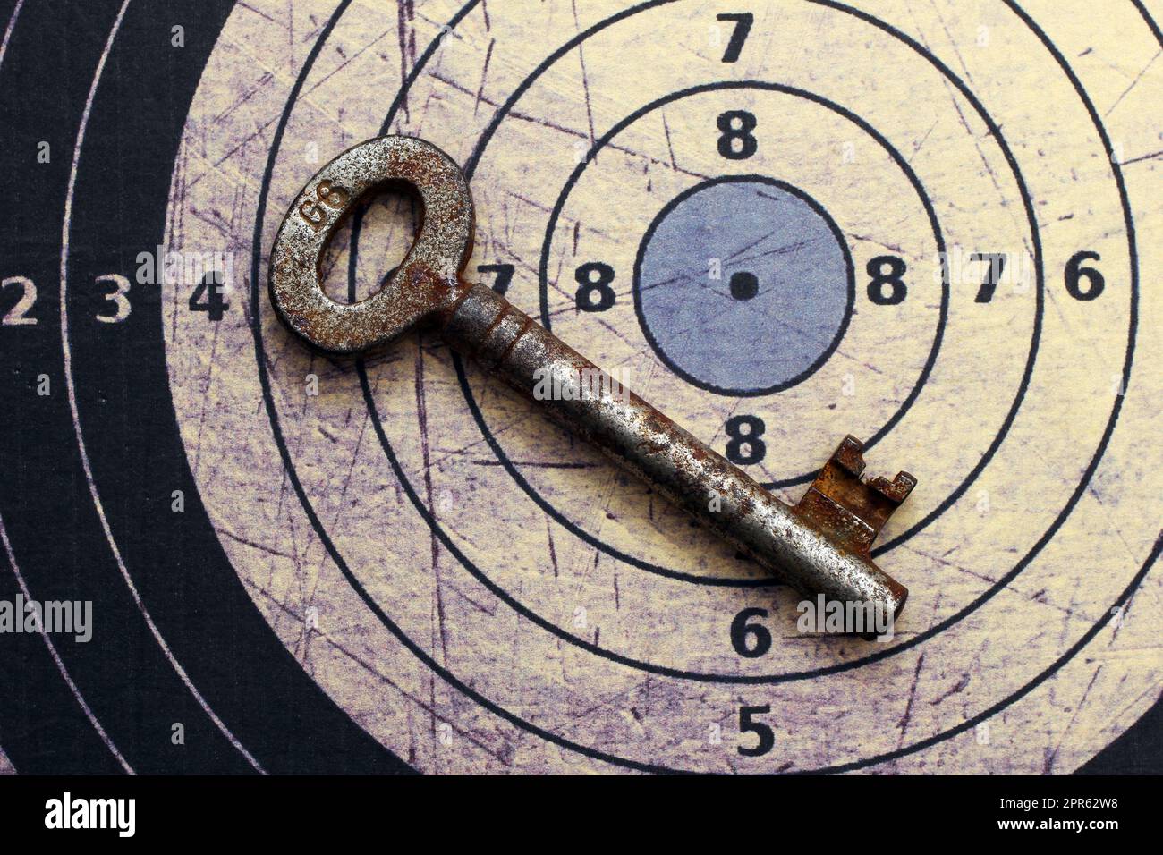 Old key on target Stock Photo - Alamy