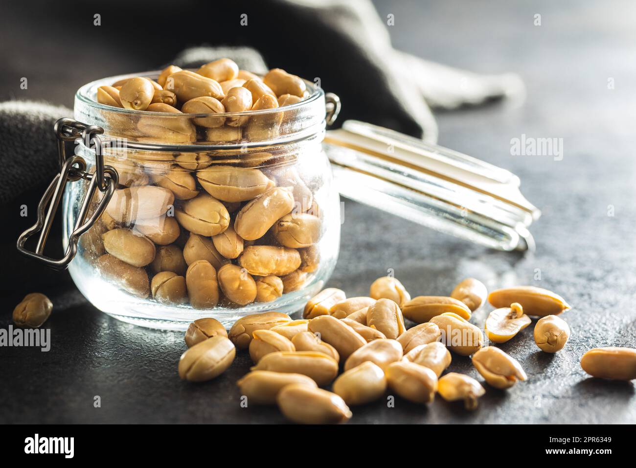 Roasted peeled peanuts in jar Stock Photo - Alamy