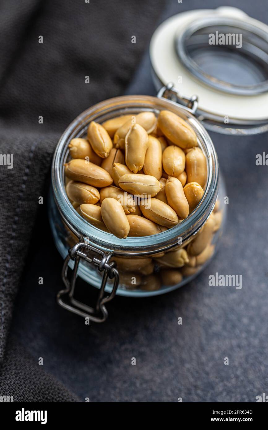 Roasted peeled peanuts in jar Stock Photo - Alamy