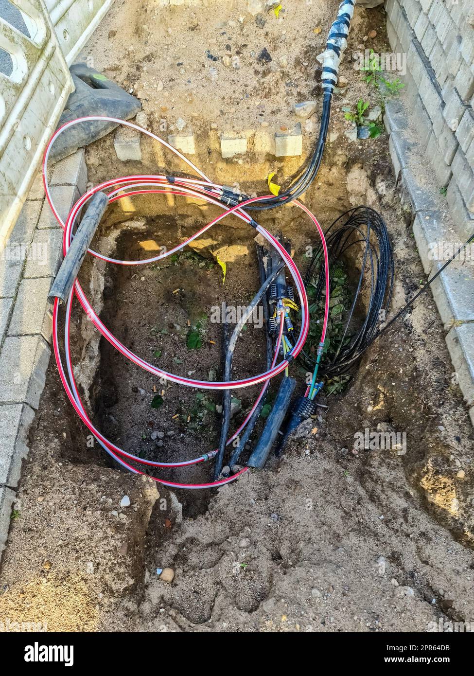 View into a small excavation pit with cables lying around Stock Photo ...