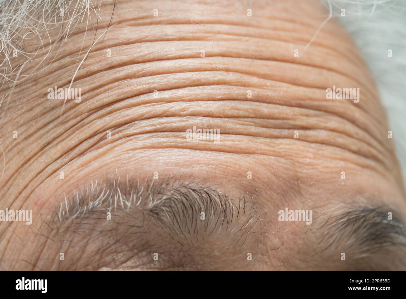 Asian elderly old woman face and eye with wrinkles, portrait closeup ...