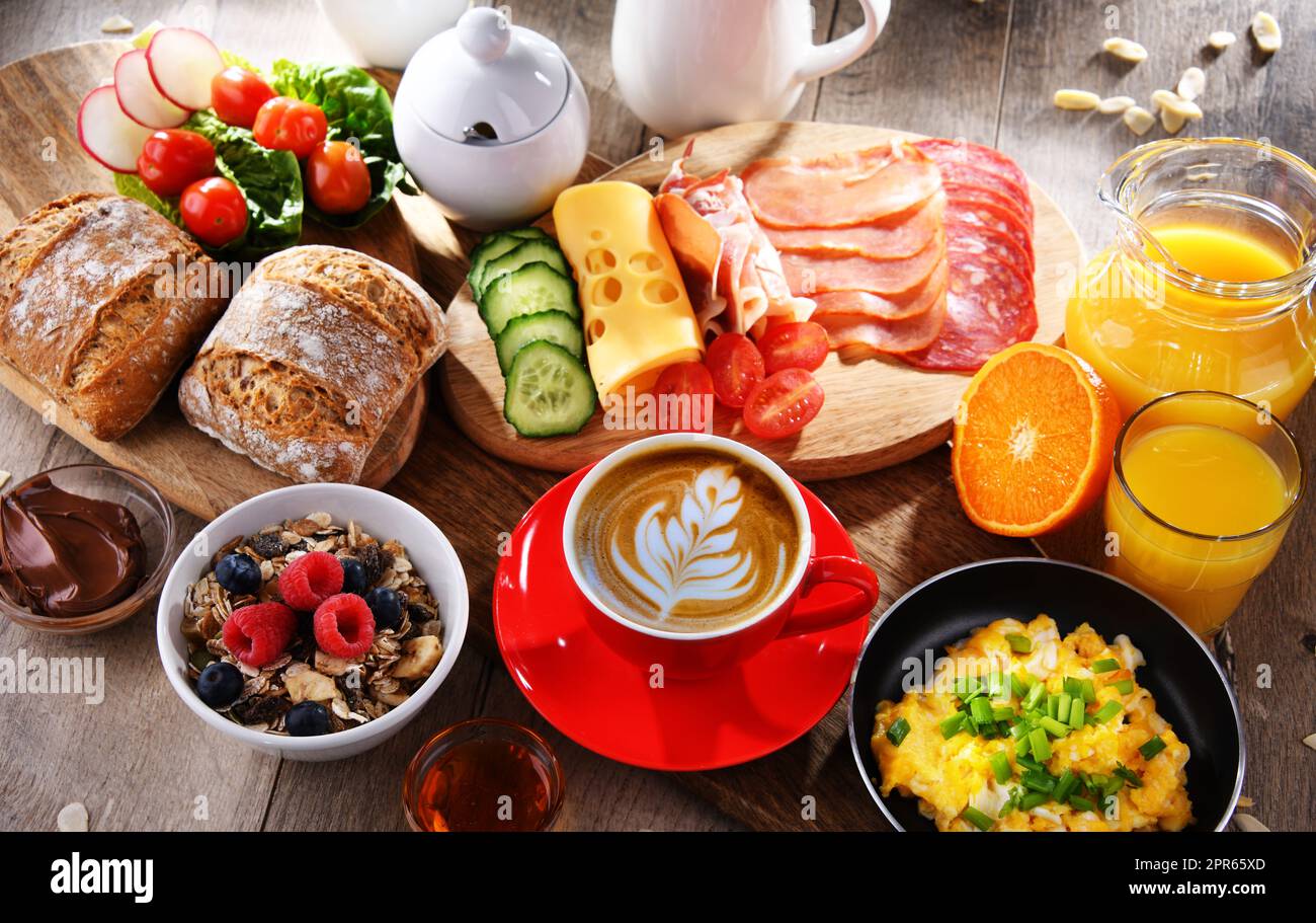 Breakfast served with coffee, scrambled eggs, cereals and ham Stock ...