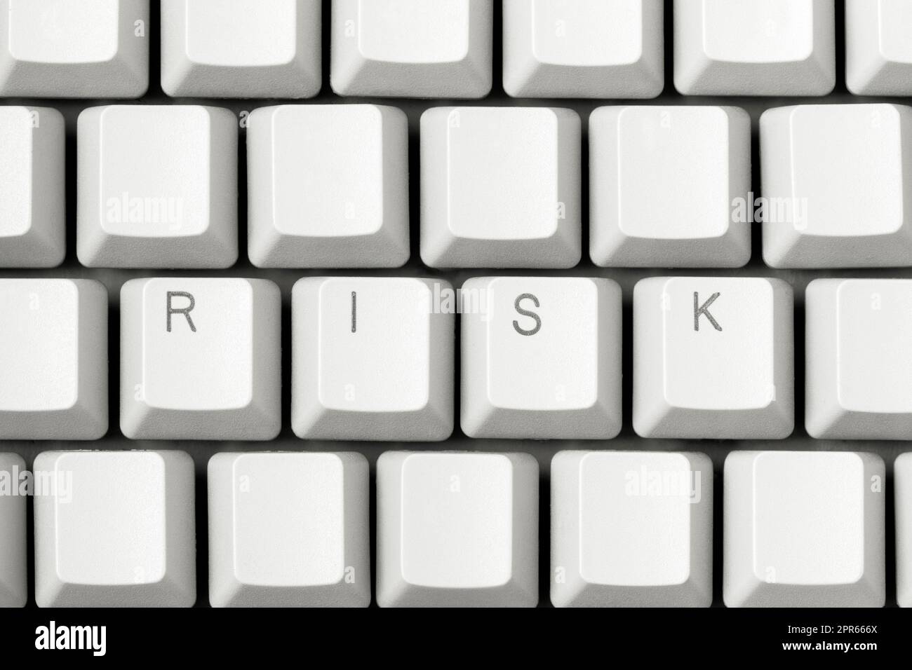 Risk lettering on white key on computer keyboard Stock Photo - Alamy