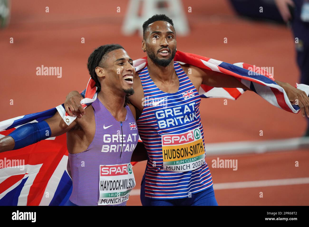 Alex Haydock-Wilson and Matthew Hudson-Smith with the flag of England ...