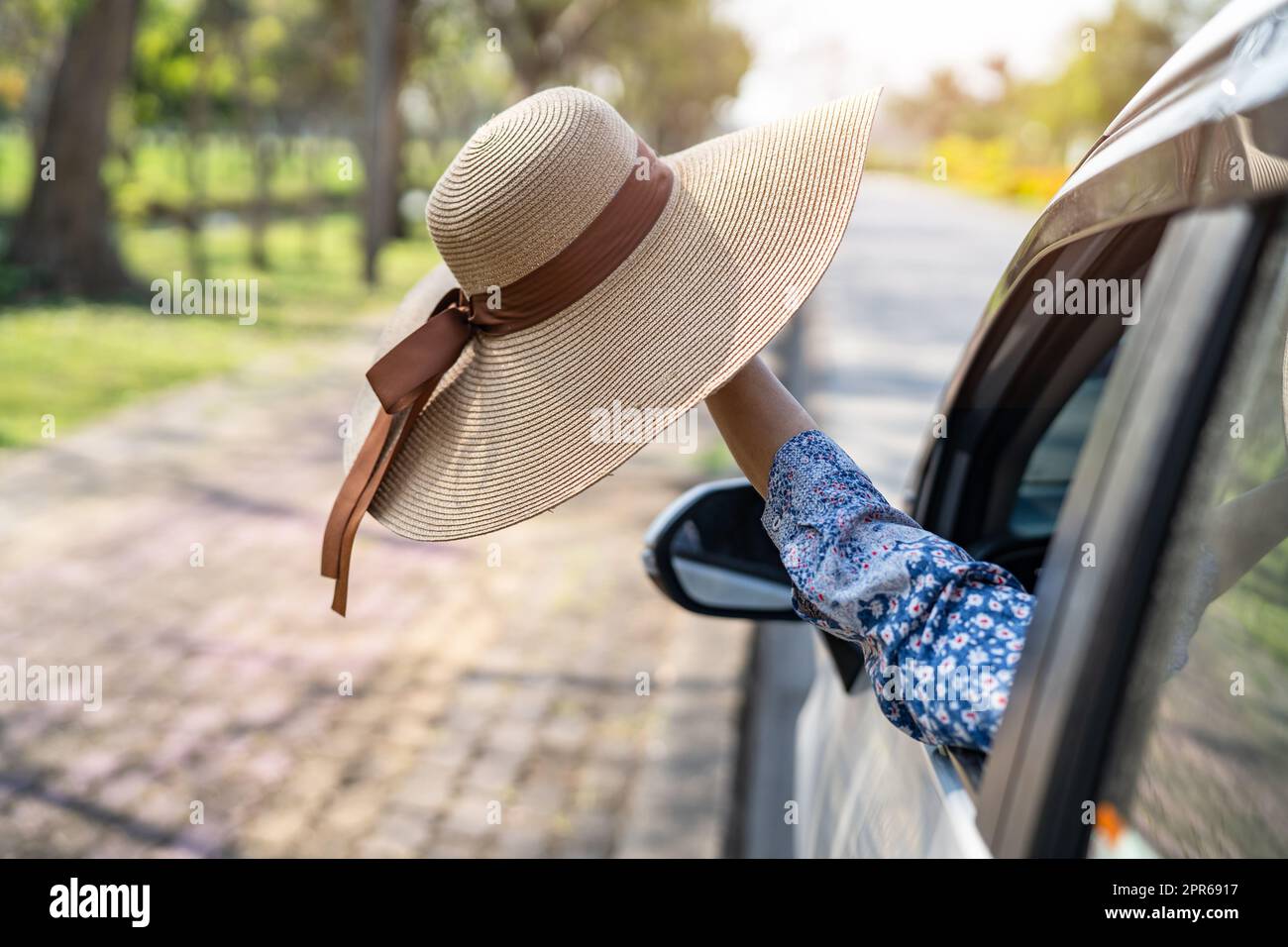 Happy enjoy and freedom in traveling trip with raised hand and holding ...