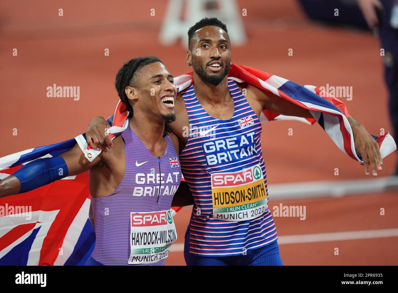Alex Haydock-Wilson and Matthew Hudson-Smith with the flag of England ...