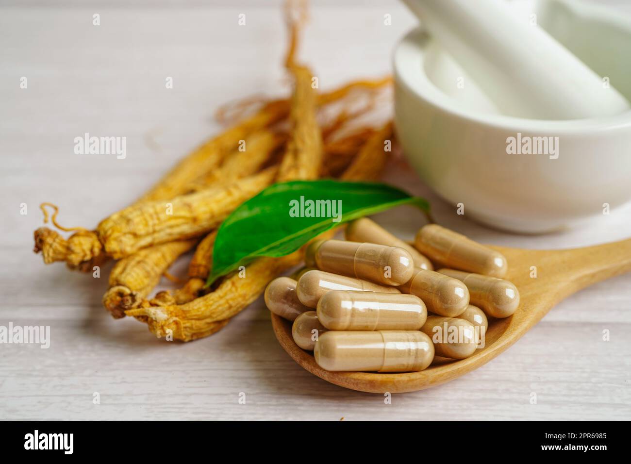 Ginseng roots and green leaf, healthy food Stock Photo - Alamy