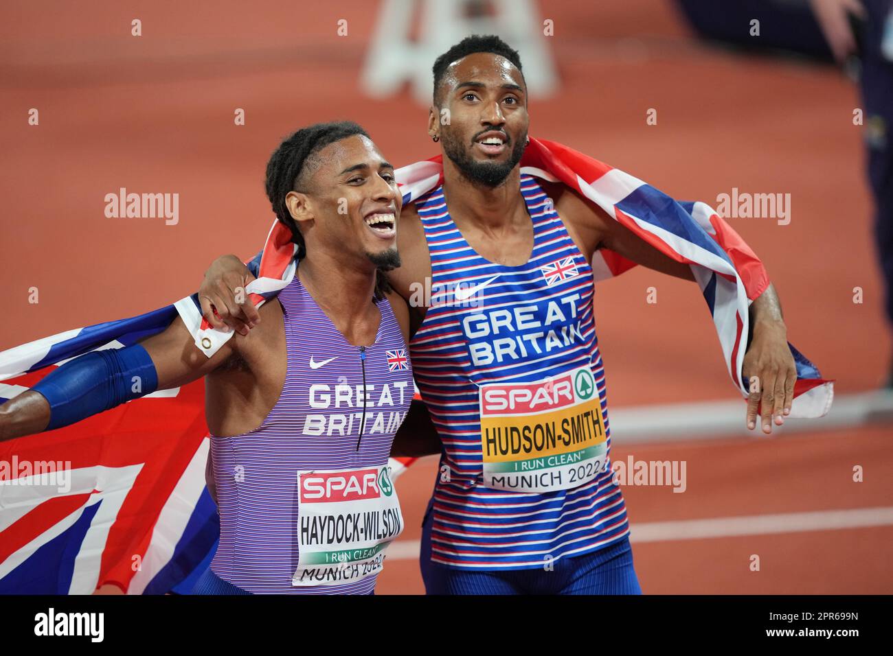 Alex Haydock-Wilson and Matthew Hudson-Smith with the flag of England ...