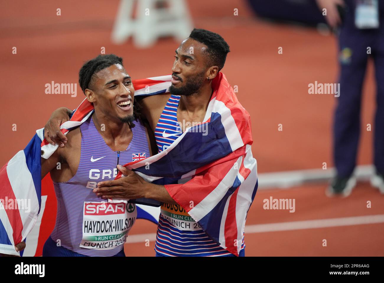 Alex Haydock-Wilson and Matthew Hudson-Smith with the flag of England ...