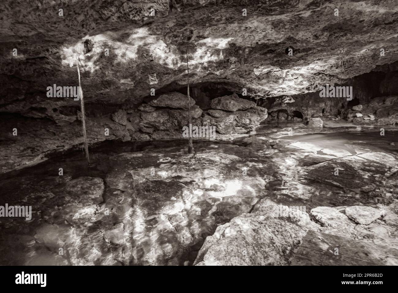 Blue turquoise water limestone cave sinkhole cenote Tajma ha Mexico ...