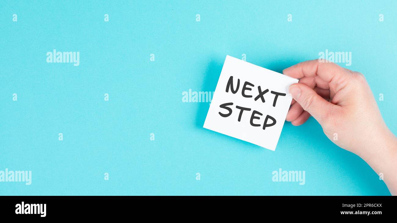 The phrase next step is standing on a paper, having new goals and ...