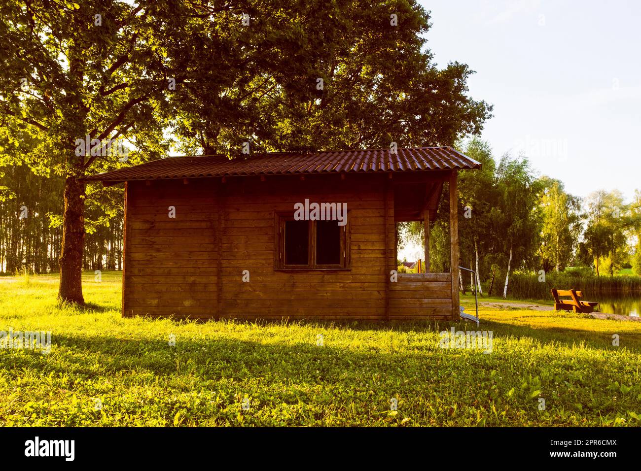 Side view of small wooden house Stock Photo - Alamy